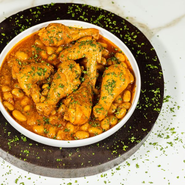 Rich tomato chicken stew with steamed dombolo - Astral Chicken