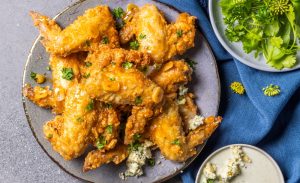 Crispy fried honey and garlic chicken winglets with gorgonzola cream ...